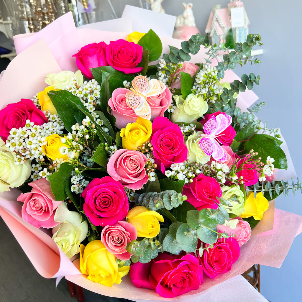 A Wrapped Bouquet of Roses Assorted Colors – Mariams Flowers